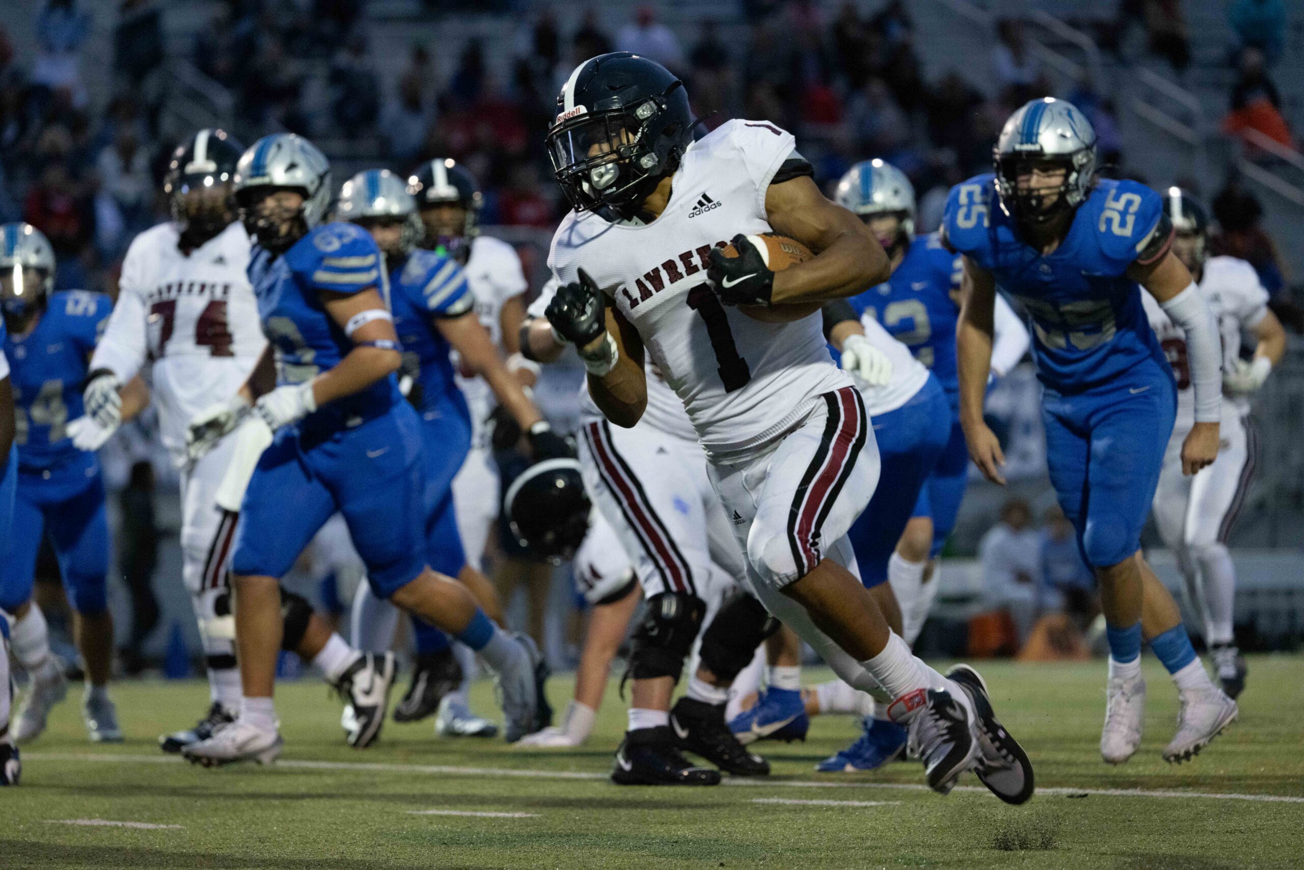Costly mistakes lead to Lawrence football’s 35-31 season-opening loss ...
